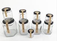 China Food Grade Glass Honey Bottles With Metal Lid Eco - Friendly Feature for sale