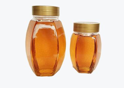 China Oval Hexagonal Glass Honey Jars Transparent Color Moistureproof Feature for sale