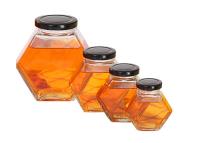 China 250ml-750ml Glass Honey Jars With Lids , Hexagon Glass Jars Clear Color for sale