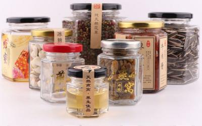 China Hexagonal Glass Honey Jars 45ml-730ml Food Container Lead Free Sealed Bottle for sale