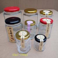 China Hexagonal Glass Honey Jars 45ml-730ml Food Container Lead Free Sealed Bottle for sale