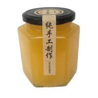 China Hexagonal Glass Honey Jars 45ml-730ml Food Container Lead Free Sealed Bottle for sale