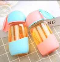China 340ml Kids Rabbit Shaped Gift Unbreakable Glass Water Bottle With Silicone Sleeve for sale