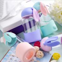 China 340ml Kids Rabbit Shaped Gift Unbreakable Glass Water Bottle With Silicone Sleeve for sale