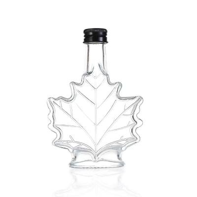 China Maple Leaf Shape Clear Glass Wine Bottles 70ml 100ml 250ml For Restaurants for sale