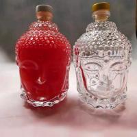 China Buddha Head Shape Empty Glass Wine Bottles Unique 750ml For Vodka / Whisky With Stopper for sale