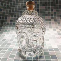 China Buddha Head Shape Empty Glass Wine Bottles Unique 750ml For Vodka / Whisky With Stopper for sale