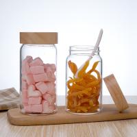 China High Borosilicate Empty Glass Jars Air Tight Storage Jars Containers With Wood Lid for sale