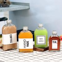China 350ml Juice Glass Drinking Bottles Flat Wine Bottle Thick Glass Bottle With Lid for sale