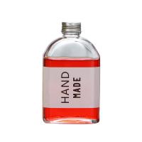 China 350ml Juice Glass Drinking Bottles Flat Wine Bottle Thick Glass Bottle With Lid for sale