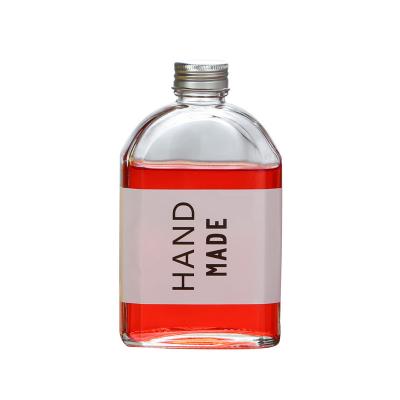 China 350ml Juice Glass Drinking Bottles Flat Wine Bottle Thick Glass Bottle With Lid for sale