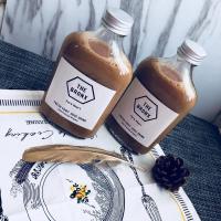 China Eco Friendly Glass Beverage Bottles 100ml Small Flat Coffee Cup With Aluminum Lid Milk Tea Bottle for sale