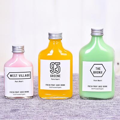 China Eco Friendly Glass Beverage Bottles 100ml Small Flat Coffee Cup With Aluminum Lid Milk Tea Bottle for sale