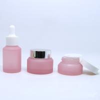 China Luxury Round Cosmetic Glass Bottles Frosted Pink Glass Bottle Eco - Friendly for sale