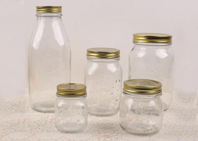 China Clear Carved Glass Storage Jars With Gold Color Screw Lid Round Shape for sale