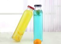 China Clear 350ml Round Glass Bottle For Milk Packaging With Colored Screw Metal Lid for sale
