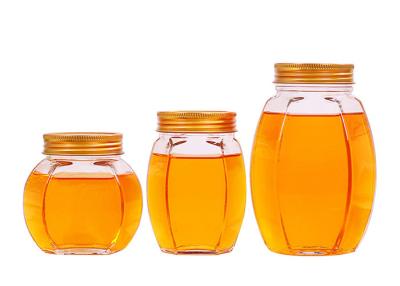 China Glass Jam Bottle Hexagon Glass Honey Jars With Twist Off Golden Lid for sale