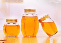 China Glass Jam Bottle Hexagon Glass Honey Jars With Twist Off Golden Lid for sale