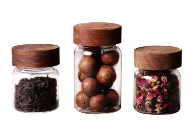 China Clear Small Coffee Canister Glass Kitchen Storage Jars With Wood Lid Round Shape for sale