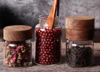 China Clear Small Coffee Canister Glass Kitchen Storage Jars With Wood Lid Round Shape for sale