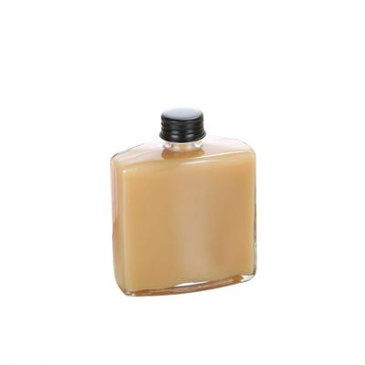 China 250ML Glass Juice Bottles With Lids for sale