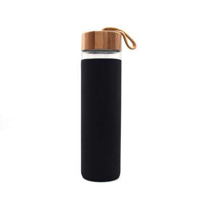 China Silicone Sleeve Bamboo Lid 600ml BPA Free Glass Water Bottle for sale