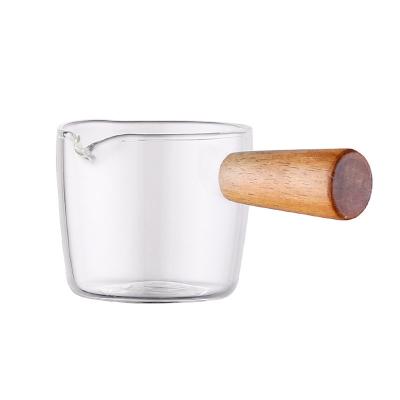 China Home Cooking Delicate Wooden Handle Glass Measuring Spoon for sale