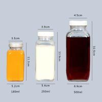 China Square Clear Glass Beverage Bottles 500ml Custom Label With Plastic Screw Lid for sale