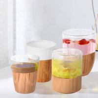 China High Borosilicate Wine Drinking Glass Cup 200ml With Wooden Bottom for sale
