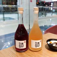 China 500ml glass liquor bottle green plum wine bottle Sealed beverage bottle with lid​ for sale