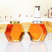 China Custom 230ml 350ml hexagon honey glass jar with Metal Lids and labels for sale