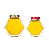 China Custom 230ml 350ml hexagon honey glass jar with Metal Lids and labels for sale