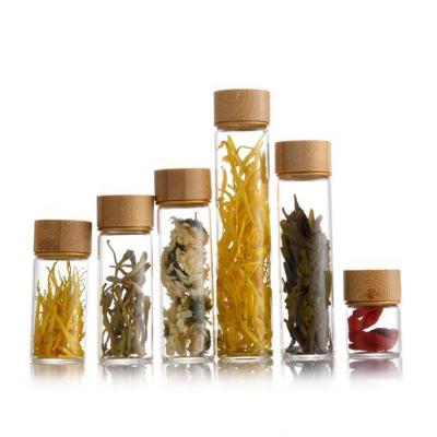 China Hot Sale Mini Bamboo Lid Glass Packaging Bottle Small Borosilicate Glass Bottle for sale