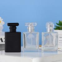 China 100ml Black White Colored Glass Spray Perfume Bottle  with Pump Sprayer for sale