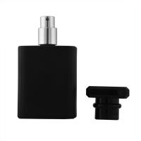 China 100ml Black White Colored Glass Spray Perfume Bottle  with Pump Sprayer for sale