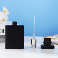 China 100ml Black White Colored Glass Spray Perfume Bottle  with Pump Sprayer for sale