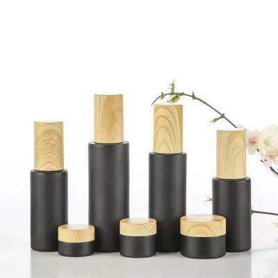 China 6ml Leakproof Cosmetic Glass Bottles Roller Ball Perfume Bottle With Bamboo Lid for sale