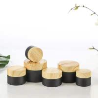China 6ml Leakproof Cosmetic Glass Bottles Roller Ball Perfume Bottle With Bamboo Lid for sale