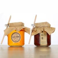 China Custom 250ml Glass Honey Jars Glass Pickle Jar With Wood Spoon for sale