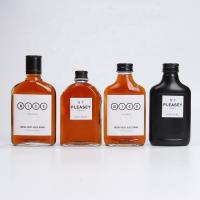 China Food Grade Classic Cold Brew Coffee Glass Bottles With Colour Spray for sale