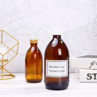 China 8oz 16oz Amber Glass Drinking Bottles 500ml Glass Vodka Bottles With Cork Caps for sale