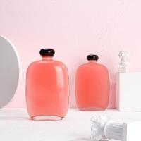 China 250ml 350ml Juice Hip Flask Bottles Cold Brew Glass Bottles With Metal Lids for sale