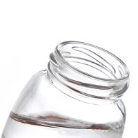 China Empty Lotus Shaped Glass Honey Jars Eco Friendly With Screw Lid for sale