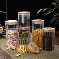 China 750ml 1000ml Borosilicate Glass Storage Jars With Bamboo Wooden Lids for sale