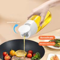 China 700ml Automatic Opening Olive Oil Glass Bottles Transparent Color for sale