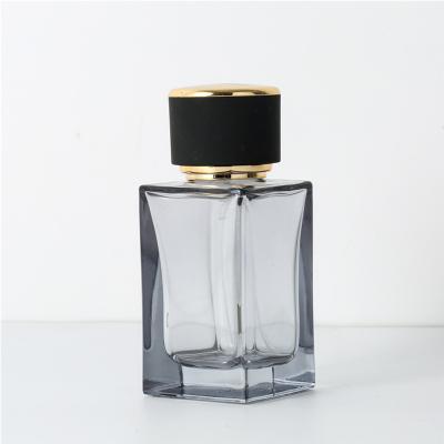 China Luxury Square 50ml Perfume Cosmetic Glass Bottles With Spray Cap for sale