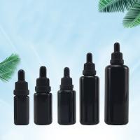 China 10ml 30ml Cosmetic Black Glass Dropper Bottle With Screw Cap for sale