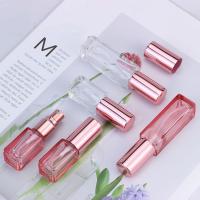 China Luxury 10ml 30ml Empty Cosmetic Glass Bottles Pink Glass Perfume Bottles for sale