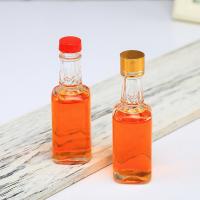 China Carton Packing Square 50ml Empty Glass Wine Bottles Embossed With Screw Cap for sale