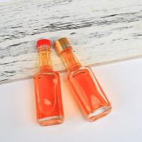 China Carton Packing Square 50ml Empty Glass Wine Bottles Embossed With Screw Cap for sale